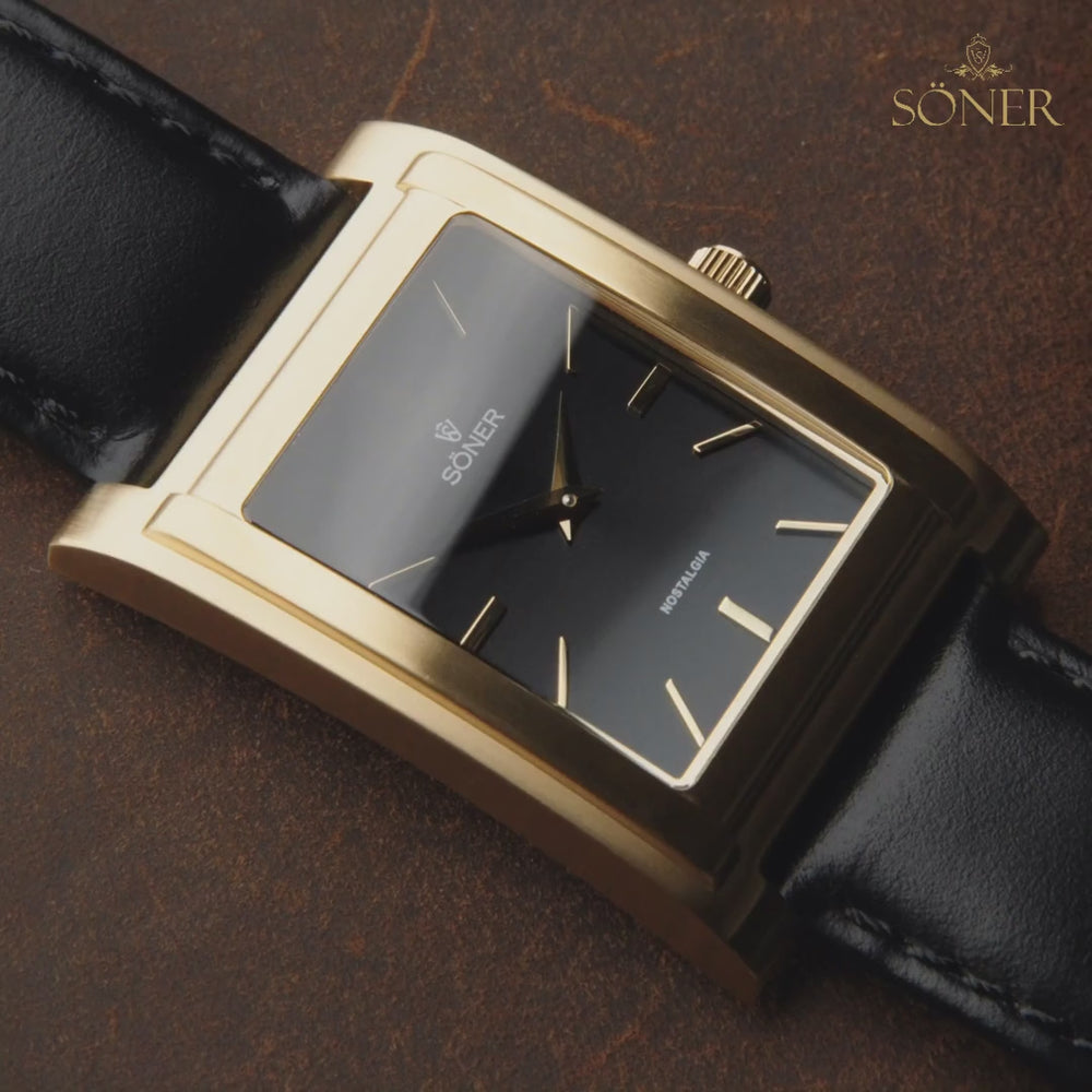 Monaco, a rectangular watch in brushed gold with a black dial